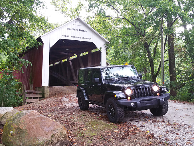 Modern meets historic as this Jeep prepares to cross a bridge built when horsepower meant actual horses. Some roads are worth the detour.