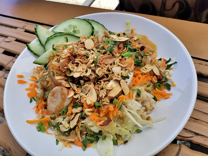 Crunchy almonds, fresh cucumbers, and colorful vegetables top this vibrant salad, offering you a refreshing and healthy meal to enjoy.