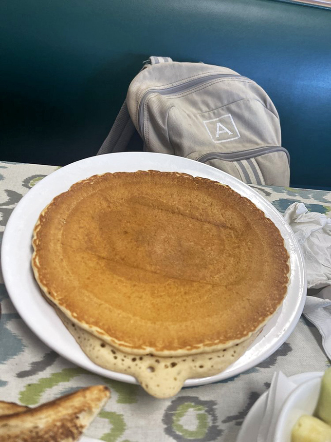 This golden pancake isn't just breakfast – it's an edible sunshine disk that puts Florida's famous rays to shame.