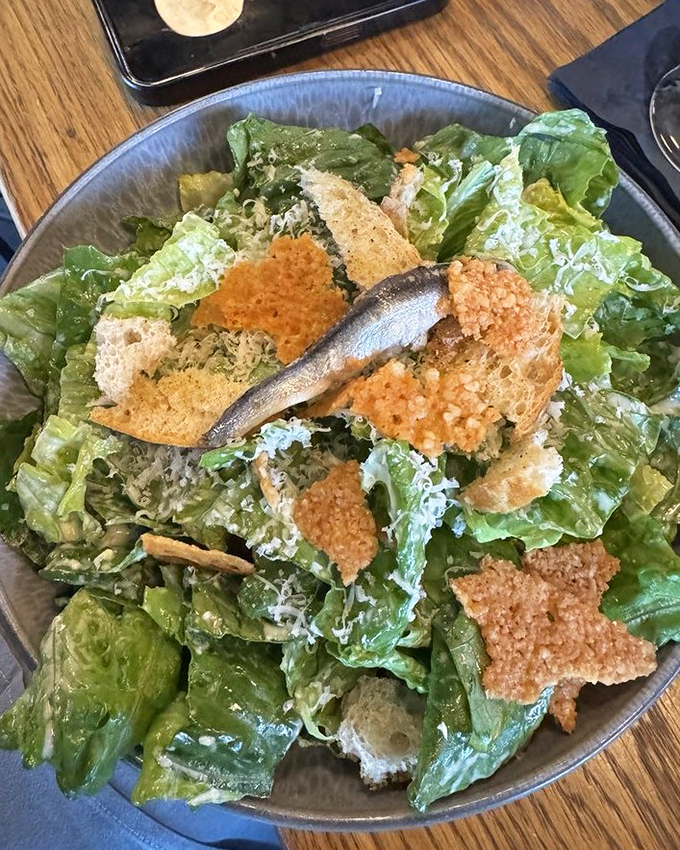 A Caesar salad that Julius himself would approve&mdash;crisp romaine, parmesan snowfall, and those gloriously crunchy croutons that shatter just right.