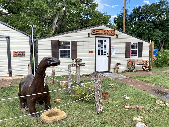 Camp Works greets visitors with frontier charm and a dinosaur statue, because why shouldn't remote Oklahoma have dinosaurs?