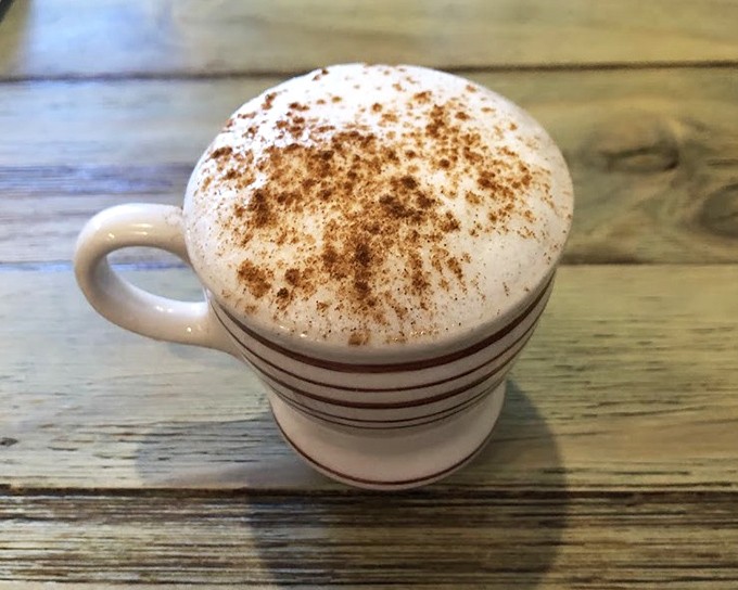 This cappuccino, dusted with cinnamon like a gentle Florida snowfall, promises to turn any morning frown upside down.