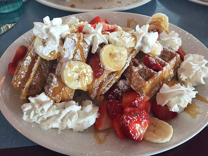 French toast that's dressed for success with fresh fruit, whipped cream, and enough decadence to make breakfast feel like a celebration.