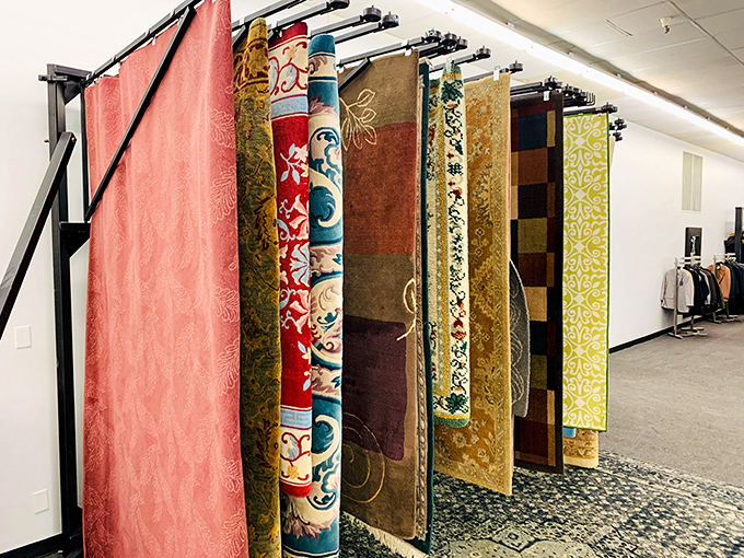 Rugs hanging like tapestries, each pattern telling tales of dining rooms, living rooms, and decades of family gatherings.