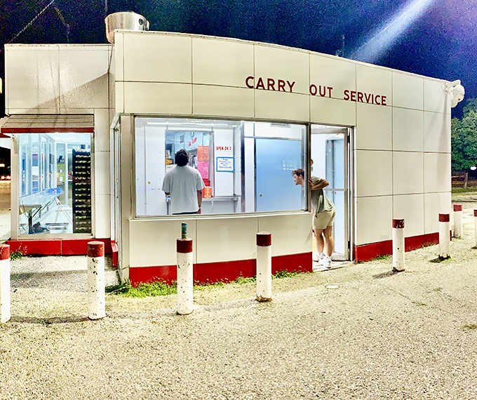 The carry-out window serves as a portal to flavor town, where hungry customers line up for their turn at Telway's legendary offerings.
