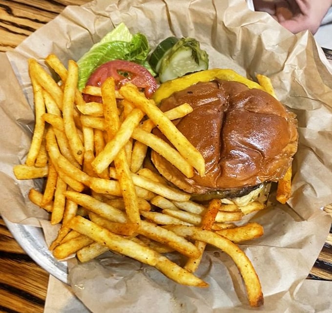 A burger that requires both hands, a stack of napkins, and possibly a signed liability waiver. Worth every delicious risk.