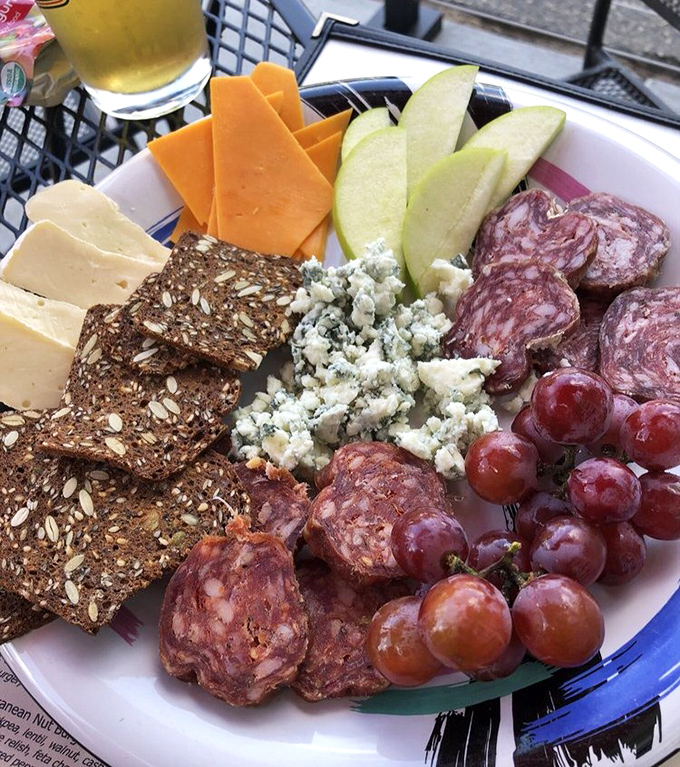 A cheese and charcuterie plate that doesn't need to show off—it knows exactly how good it is. The kind of spread that turns "quick drinks" into three-hour conversations.