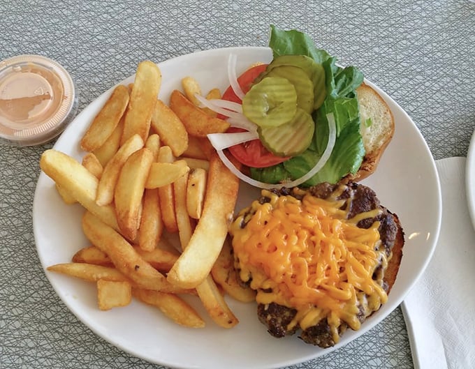 This isn't just a cheeseburger and fries&mdash;it's edible architecture where each layer contributes to a perfectly balanced bite that satisfies on a primal level.