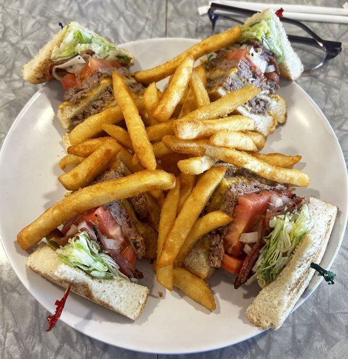 A club sandwich surrounded by golden fries&mdash;the lunch equivalent of a warm hug that doesn't ask questions about your morning or judge your bedhead.