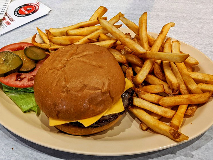 The cheeseburger and fries arrive like old friends who always know exactly what to say when you need comfort most.
