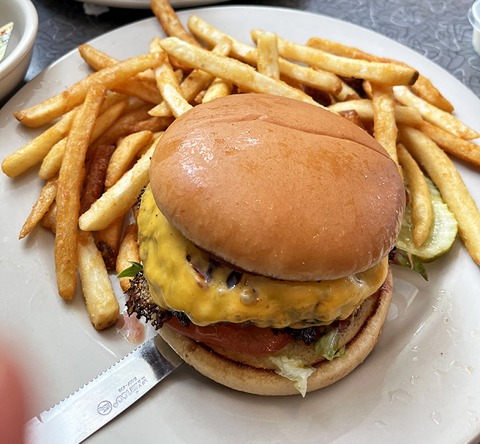 The cheeseburger that launched a thousand napkins&mdash;perfectly melted cheese cascading down a patty that means business.