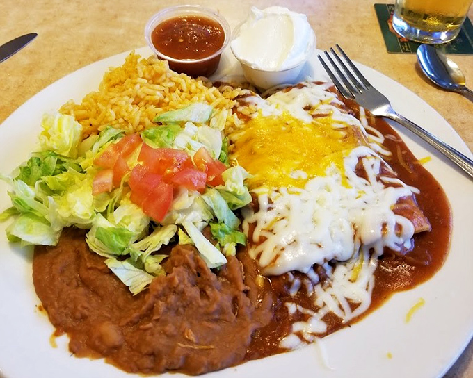 Enchiladas smothered in sauce and cheese &ndash; proof that sometimes the messiest foods make for the most memorable meals.
