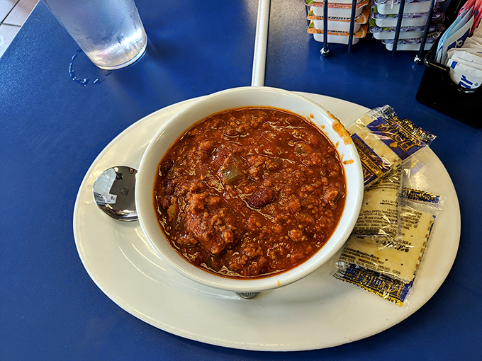 A bowl of chili that doesn't mess around. This isn't some fancy chef's interpretation&mdash;it's the real deal, served with crackers for proper scooping.