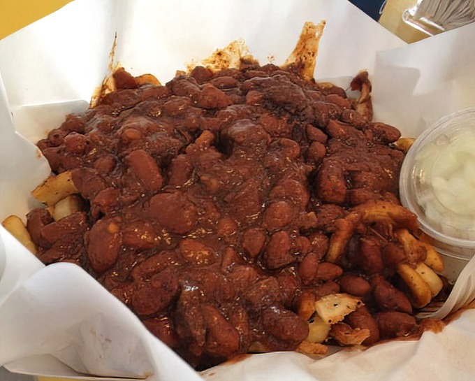 Chili fries that laugh in the face of diet plans&mdash;a glorious mess that requires both a fork and absolutely zero regrets.