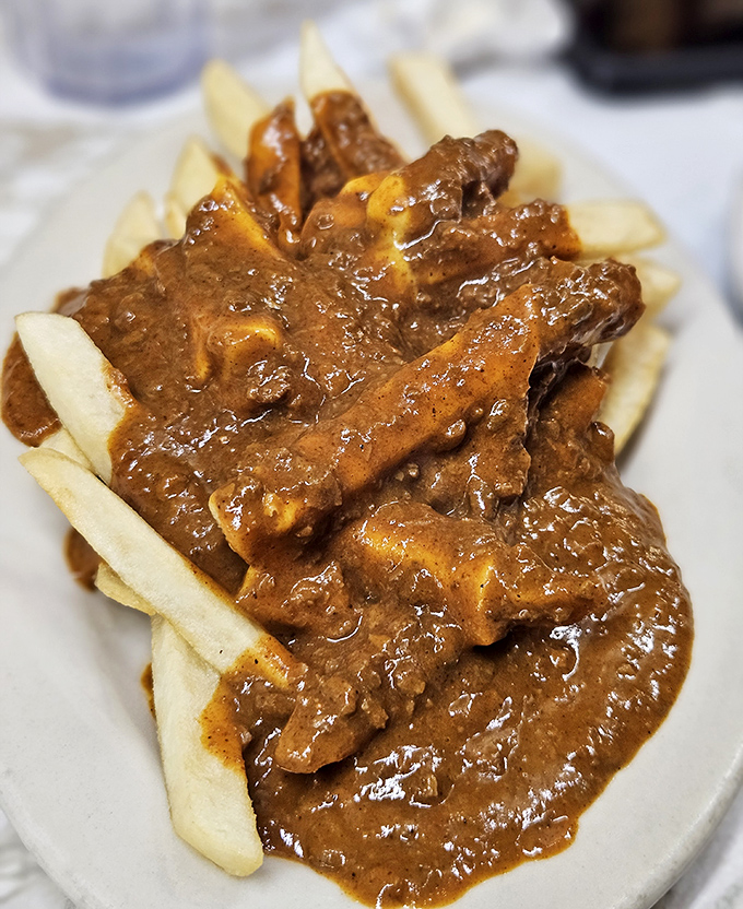 Chili fries that don't mess around&mdash;a foundation of crispy potatoes supporting a lavish pour of meaty chili that demands both fork and commitment.