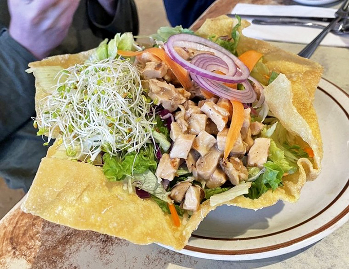 Chinese Chicken Salad in a crispy taco shell bowl, proving Ken's doesn't discriminate against any meal category whatsoever.