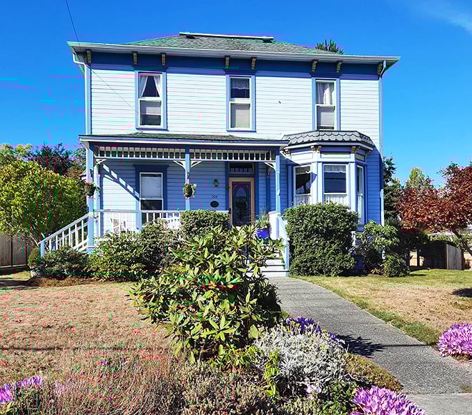 The blue Victorian home with its perfect garden isn't showing off &ndash; it's just living its best life while making the rest of us question our landscaping choices.