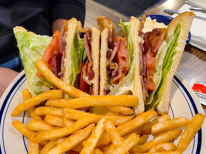 The club sandwich&mdash;architecture you can eat. Triple-decker construction with structural integrity that would impress Frank Lloyd Wright.