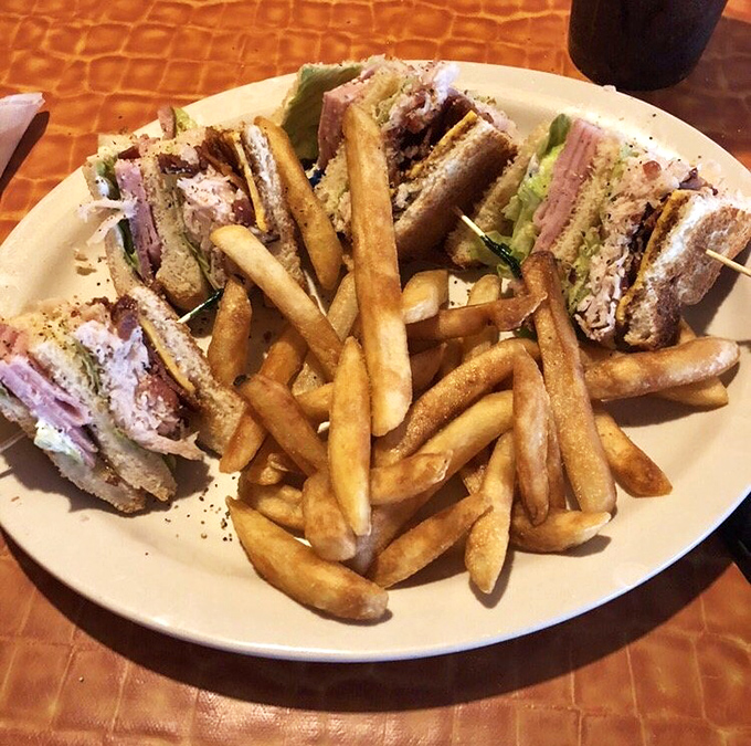 The club sandwich&mdash;the architectural marvel of the lunch world&mdash;stacked high enough to require those toothpicks and served with fries that look perfectly golden.