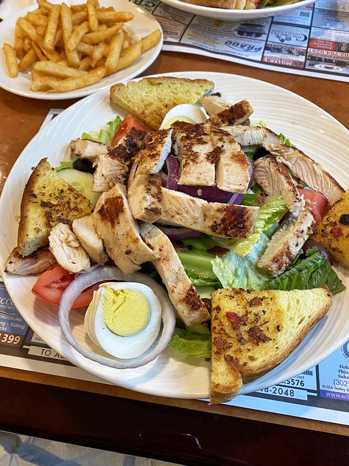 This isn't just a salad&mdash;it's a protein party where grilled chicken mingles with garden-fresh vegetables on a bed of crisp lettuce.