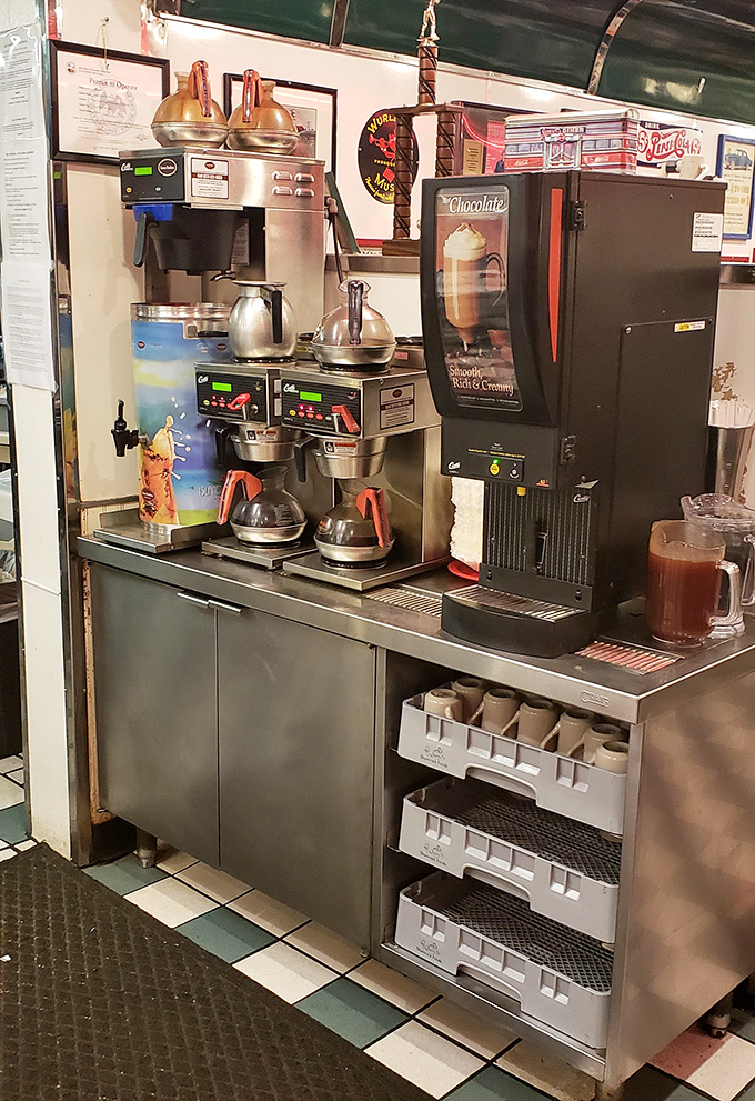 The coffee station stands ready for action, prepared to transform ordinary beans into the liquid motivation that powers Farmington's mornings.