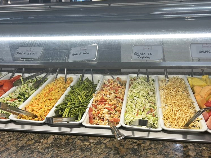 The salad bar: where health-conscious diners and those seeking the perfect meat accompaniments find common ground in colorful, fresh abundance.