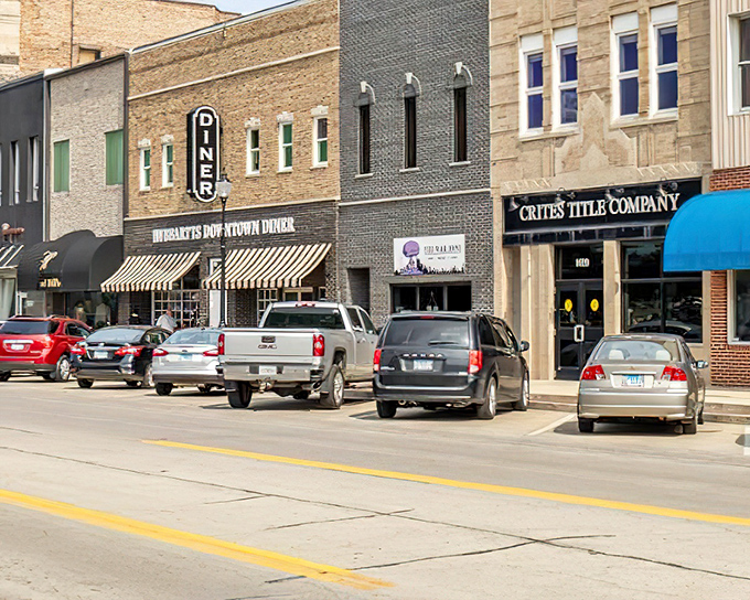 Hubbard's Downtown Diner anchors this commercial block, where pickup trucks park with purpose and breakfast conversations solve most of the world's problems.