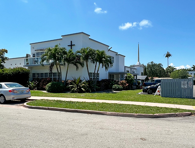 The community church's white fa&ccedil;ade gleams against the blue sky, offering spiritual respite in a setting that already feels heaven-sent.