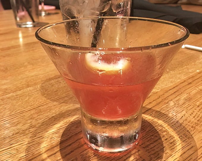 A copper-hued cocktail that catches the light just right&mdash;like liquid sunset in a glass, promising good times ahead.