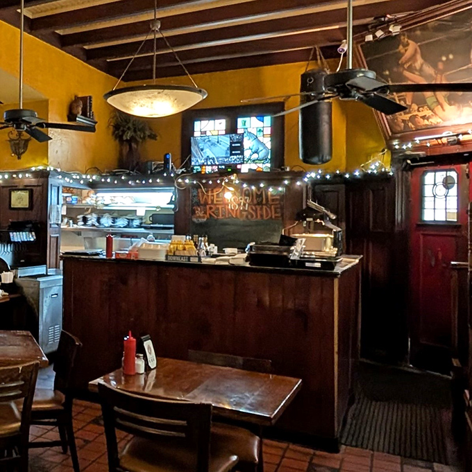 The open kitchen and counter setup invites diners into the culinary conversation. That punching bag hanging from the ceiling? Purely decorative, we hope.