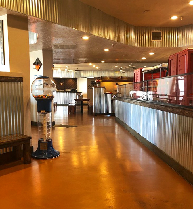 The counter where dreams come true, complete with a gumball machine because even serious BBQ joints know how to have a little fun.