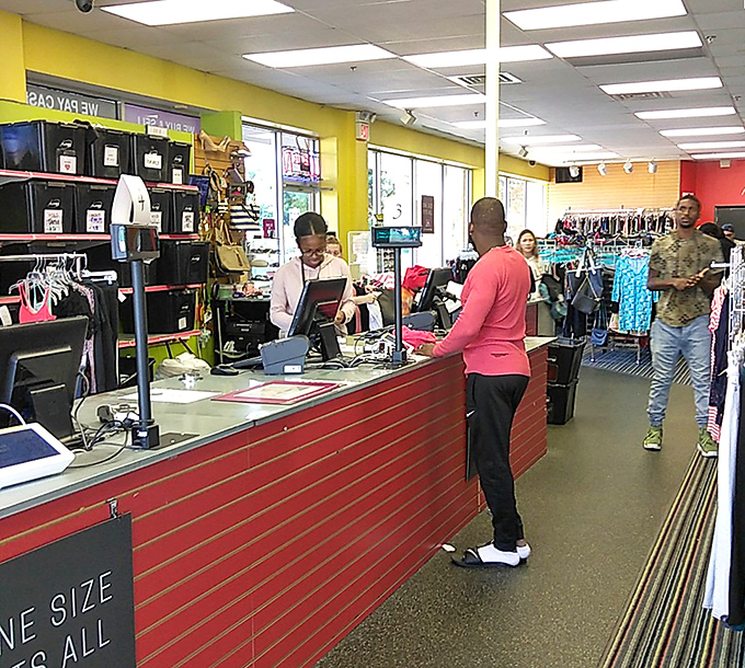 The checkout counter processes dreams come true as shoppers discover their twenty-five-dollar cart total.
