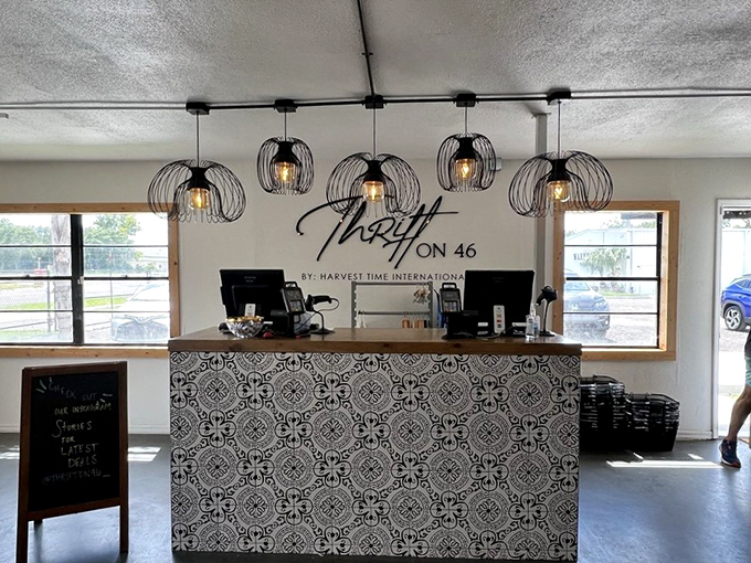 The stylish checkout counter, complete with pendant lighting, offers a final moment of retail satisfaction before heading home with your finds.