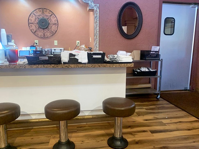 Counter seating: where solo diners become part of the Micha's family, watching the restaurant ballet while perched on stools that have supported generations.