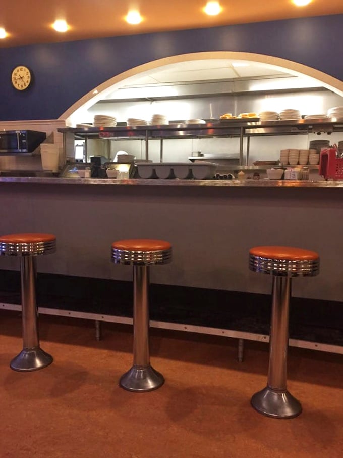Those orange counter stools aren't just seating&mdash;they're front-row tickets to the breakfast show. Best seats in the house for solo diners.