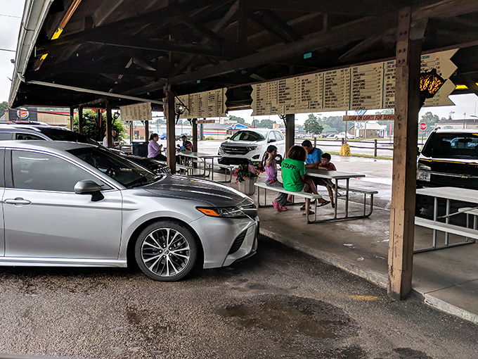 Families gather under rustic wooden beams, sharing meals and making memories. Some conversations just taste better with a side of onion rings.