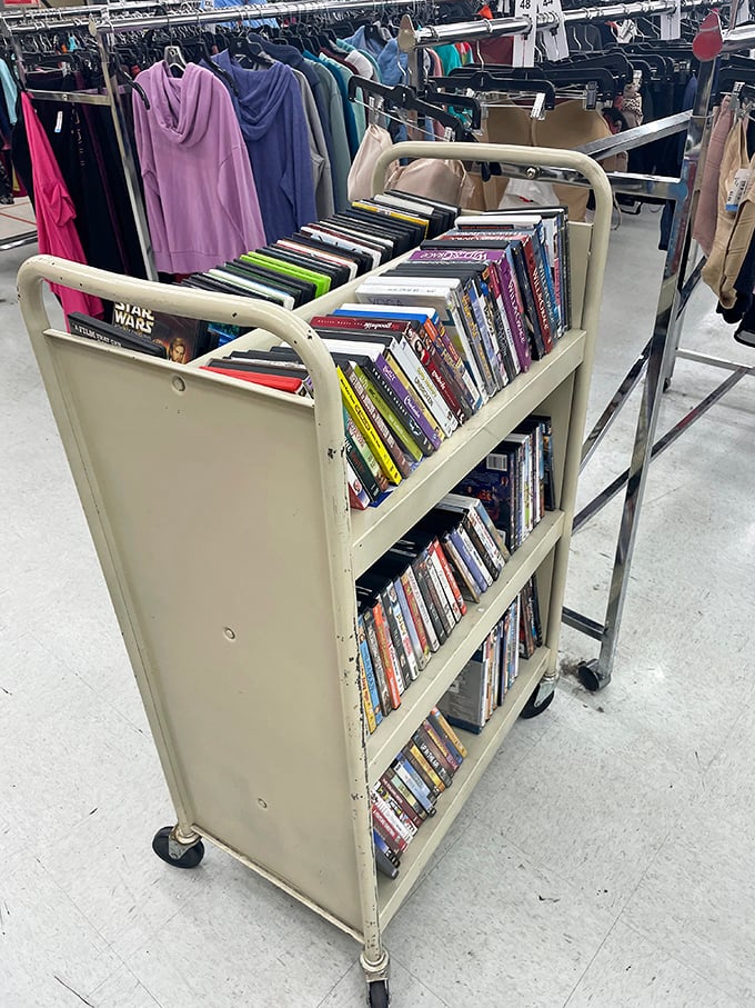 A rolling cart of DVDs and books offers entertainment on wheels. Star Wars sits comfortably next to literary classics in this mobile library.