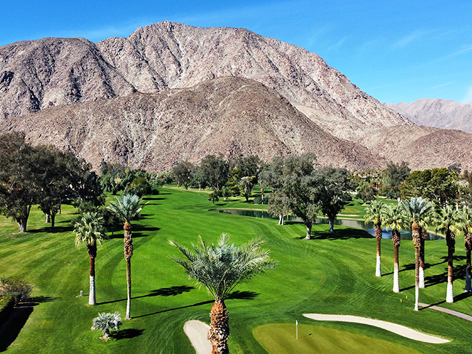 De Anza's fairways create a startling contrast against the rugged mountains, where golfers chase little white balls across meticulously maintained desert oases.
