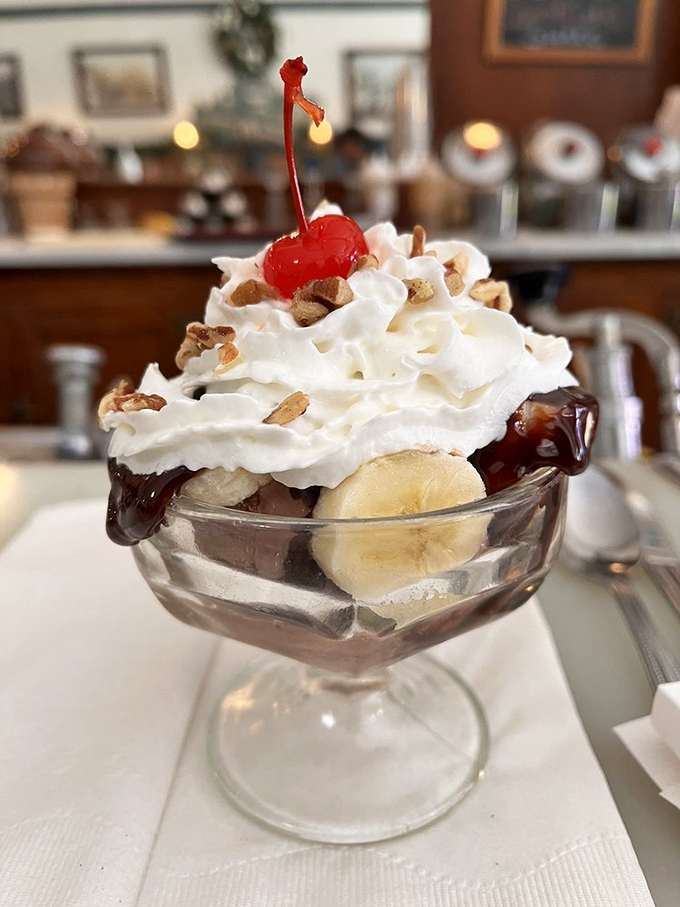 This banana split sundae isn't just dessert&mdash;it's therapy in a glass dish, complete with whipped cream clouds and a cherry on top for good measure.