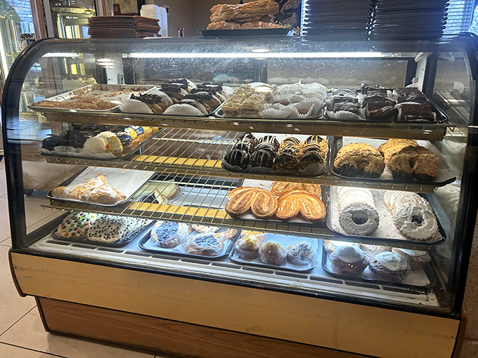 The dessert case&mdash;where willpower goes to die and "I'll just have a bite" becomes the lie we tell ourselves before ordering whole slices.