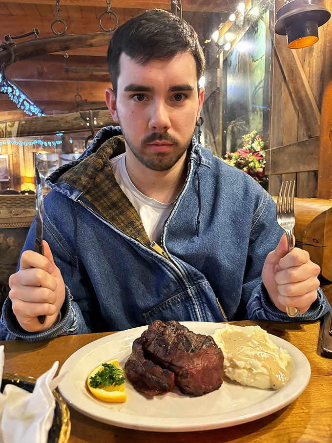 The universal expression of steak anticipation. Two forks at the ready, eyes locked on the prize&mdash;this is the face of someone about to have a religious experience.