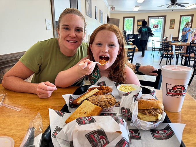 Barbecue brings families together. That look of pure joy says everything about why traditions like this matter—creating memories one bite at a time.