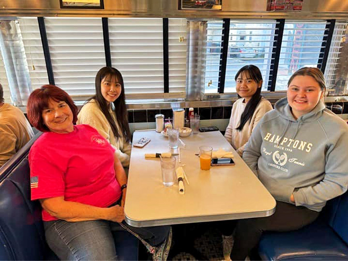 Generations gather in these booths, proving that good food brings families together and creates memories that last longer than the meal itself.