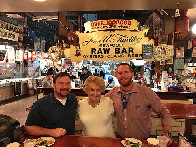 Three generations of seafood appreciation captured in one frame. This is what happens when food becomes part of a city's DNA.