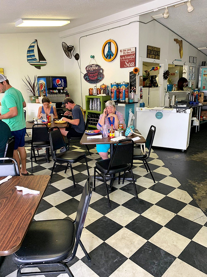 Black and white checkered floors anchor a scene of pure Americana—diners lost in conversation and the serious business of enjoying a proper breakfast.