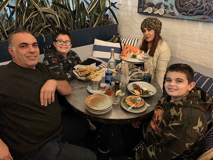 Happy diners enjoying their seafood tower&mdash;this is what pure dining joy looks like in its natural Santa Monica habitat.