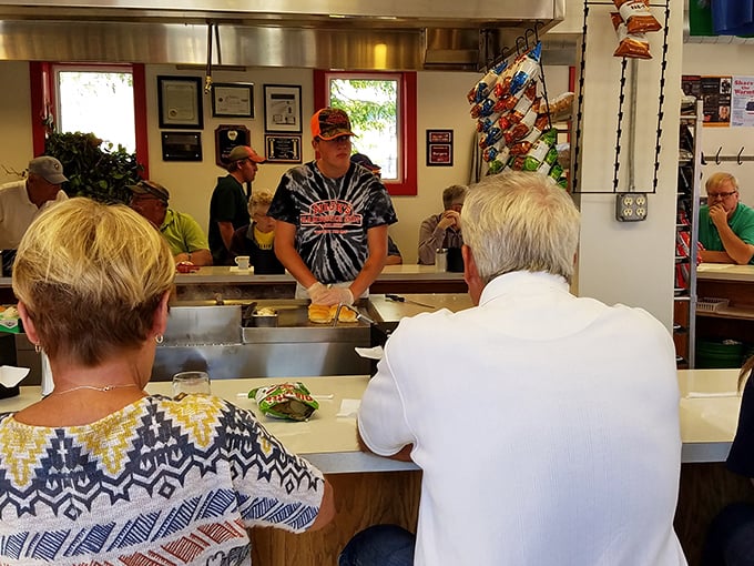 The counter experience at Nick's&mdash;where strangers become friends united by burger love. Some conversations are just better when accompanied by the sizzle of beef patties.