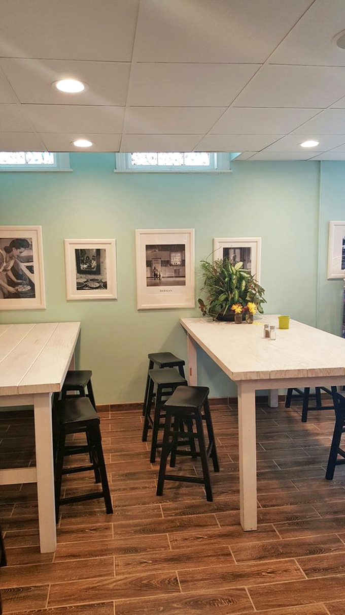 Soft blue walls and white tables create the kind of casual dining space that encourages second cups.