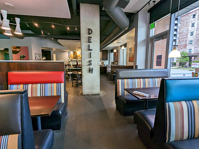 The "DELI" pillar stands sentinel in a dining room where comfort meets style, and every booth holds the promise of satisfaction.