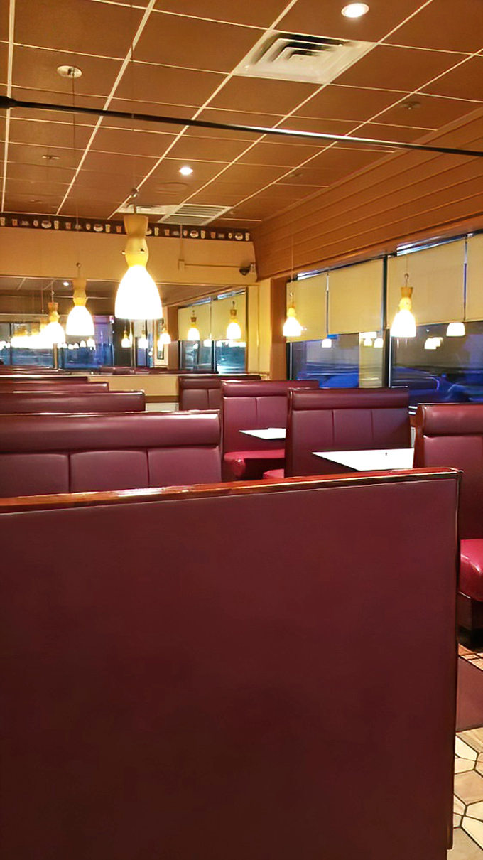 The dining area's warm lighting and booth dividers create little islands of privacy &ndash; perfect for intimate conversations or shameless pancake hoarding.